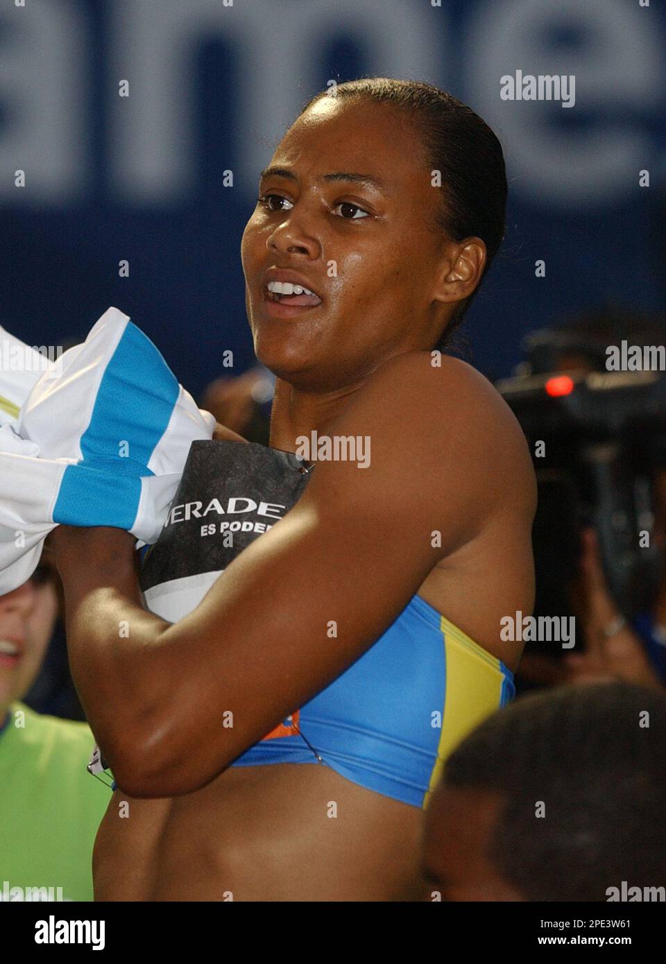 US runner Marion Jones dresses after arriving in the fourth place in ...