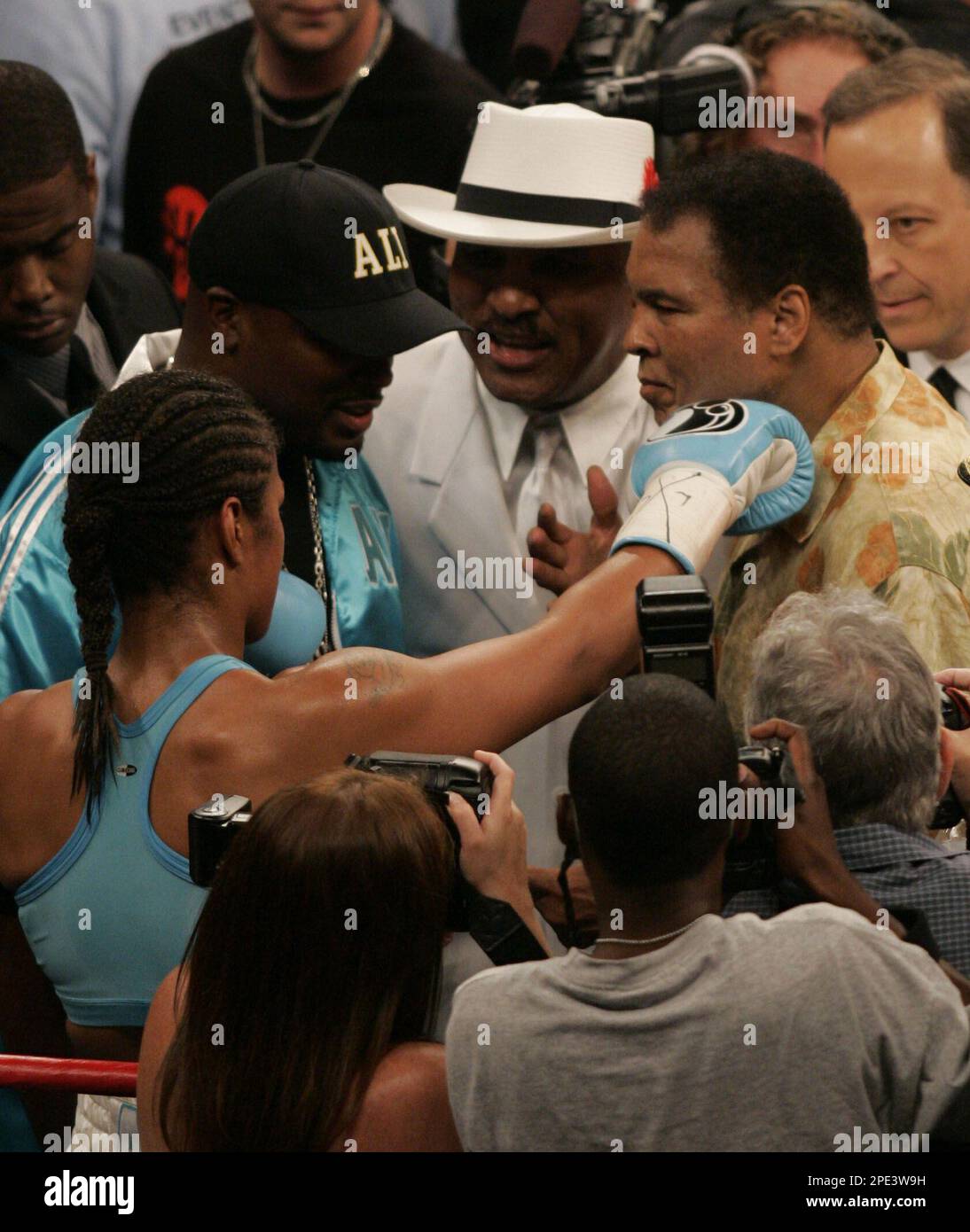 Boxing great Muhammad Ali, right, greets his daughter Laila after her ...