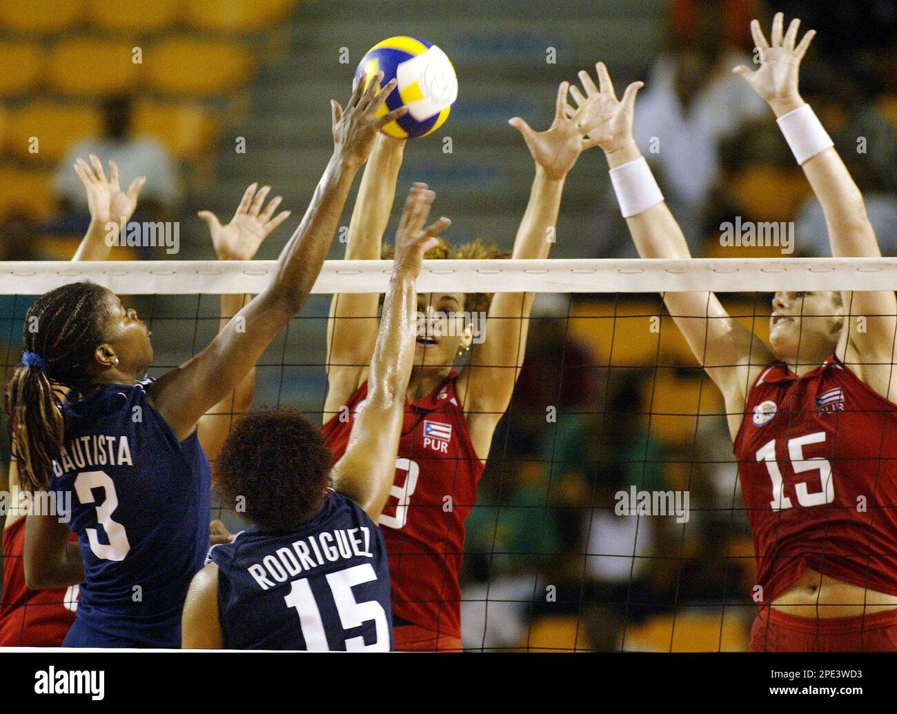 Dominican Republic's Yudelkys Bautista (3) hits the ball over Puerto ...