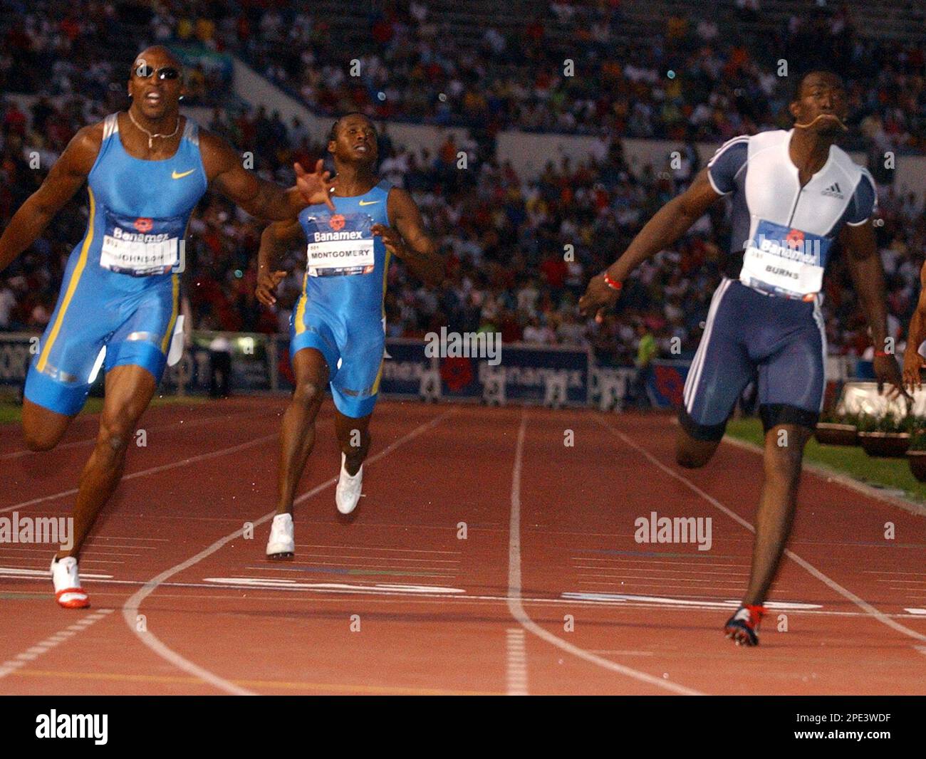 US runner JJ Johnson, left, finishes in first place with 10.18 seconds ...
