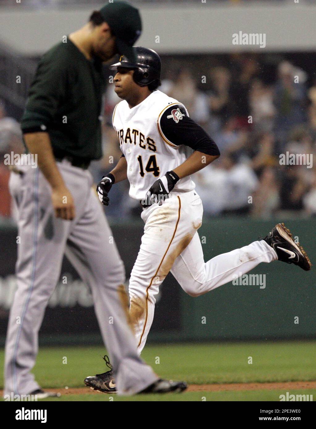 Pittsburgh Pirates' Jose Castillo (14) rounds the bases behind Tampa ...
