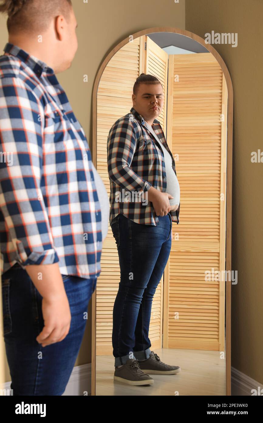 Overweight man mirror hi-res stock photography and images - Alamy