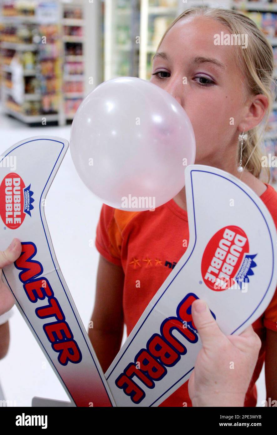 Alexa Hogberg, 12, Danville, Iowa, blows a bubble Saturday, June 11 ...