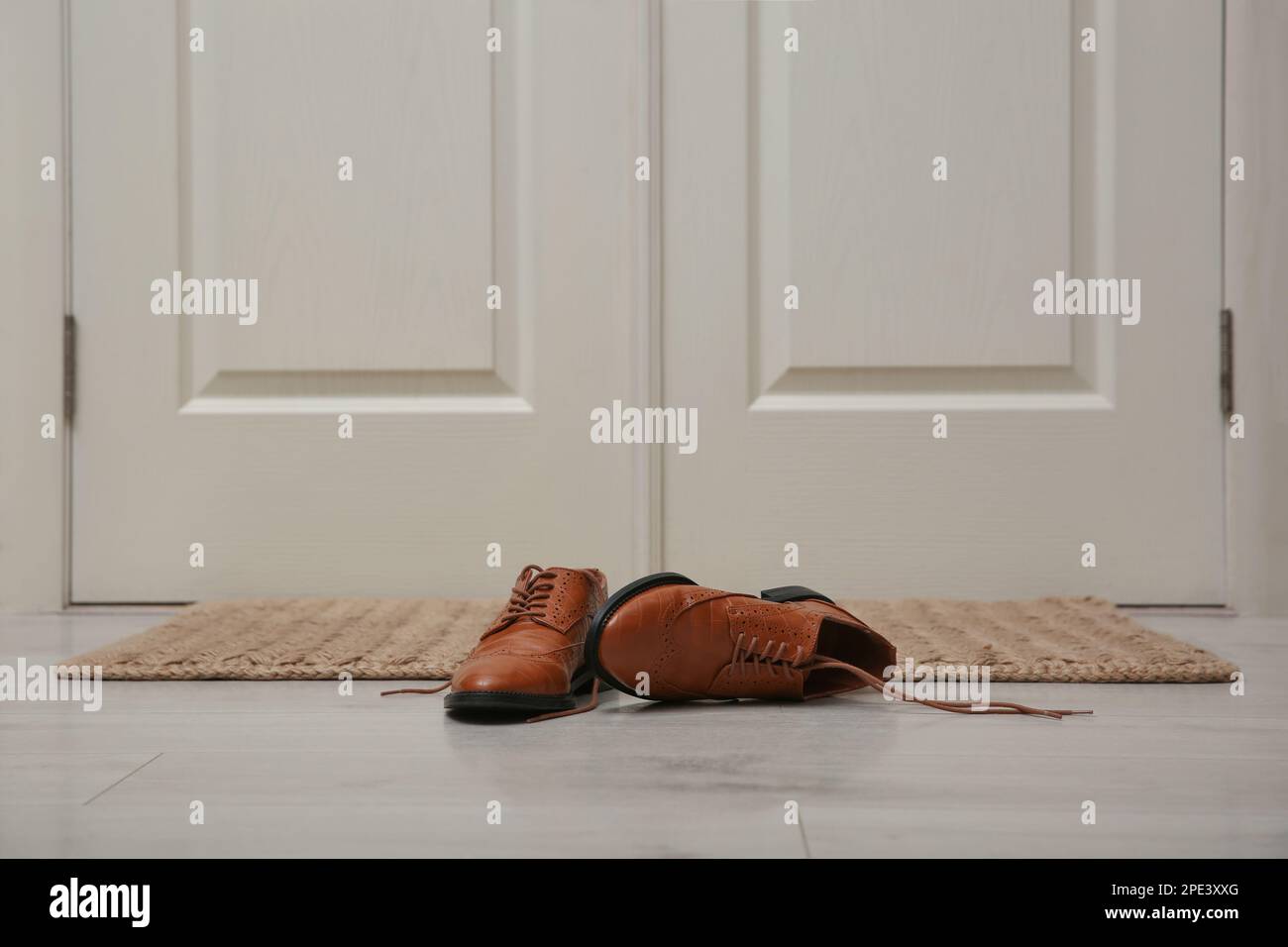 Shoes on the mat hi-res stock photography and images - Alamy
