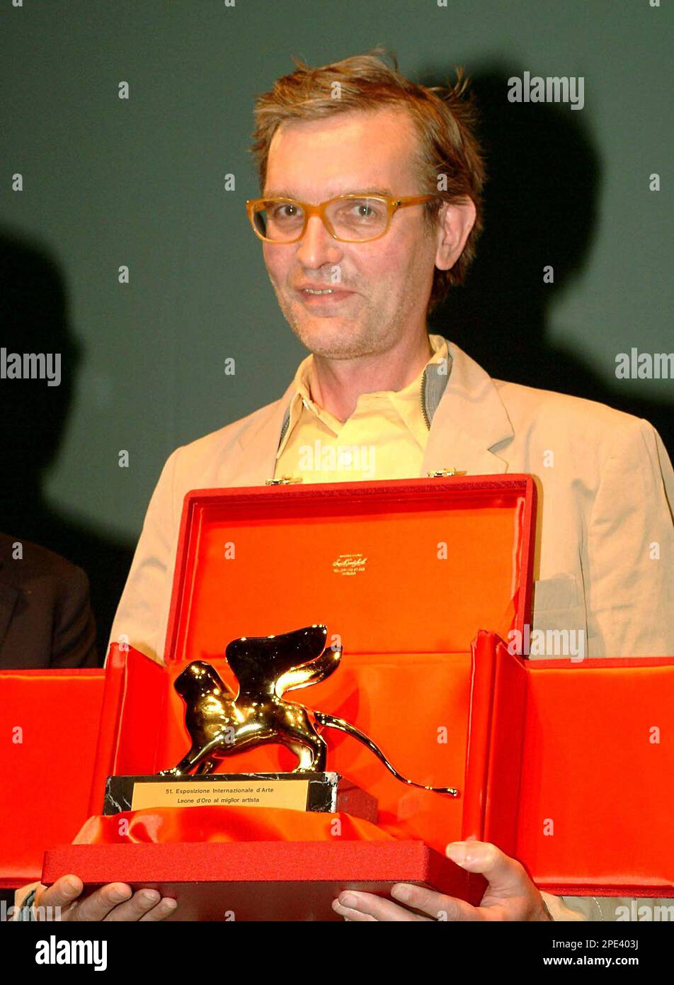 German sculptor Thomas Schutte holds the Golden Lion he won at the 51st ...