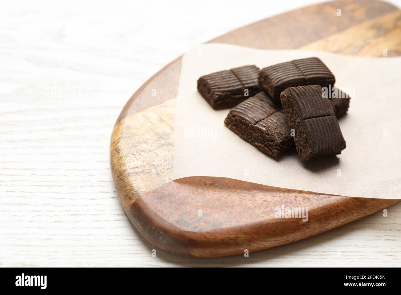 Board with delicious and healthy hematogen on white wooden table Stock ...