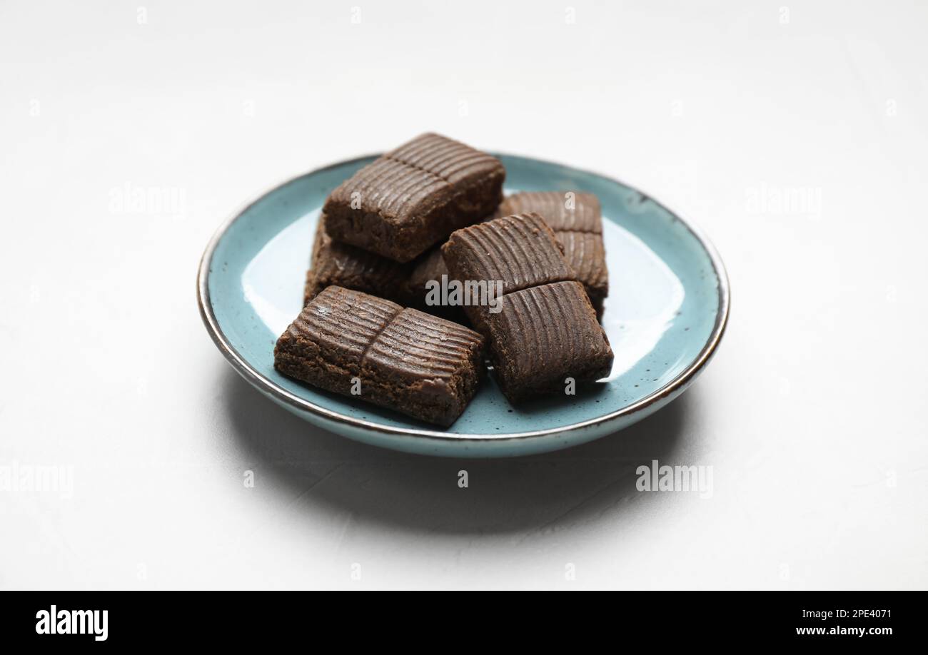 Blue plate with delicious and healthy hematogen on white table Stock ...