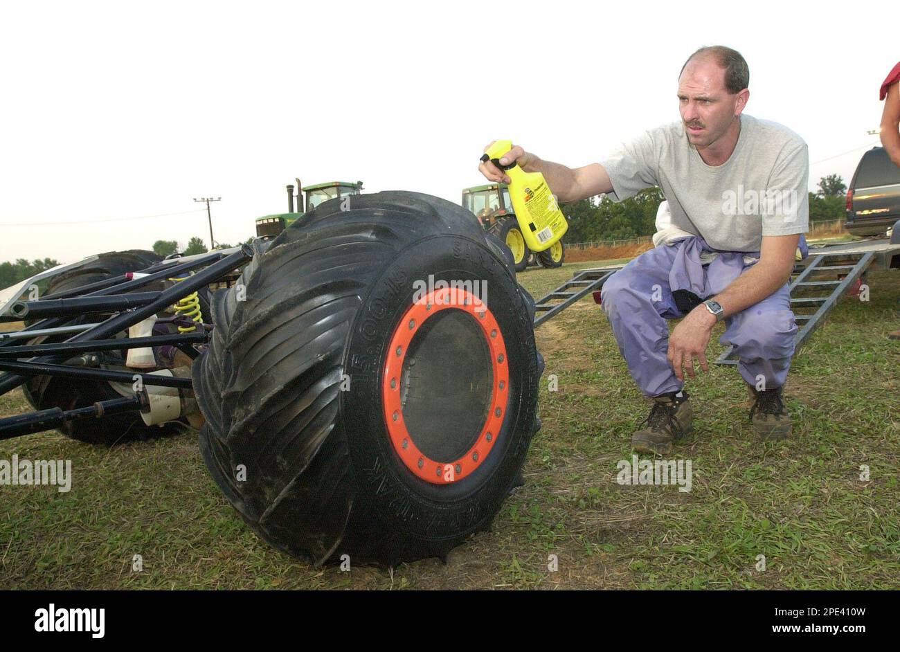 Steve Jones polishes the tires of his modified mud drag car before ...