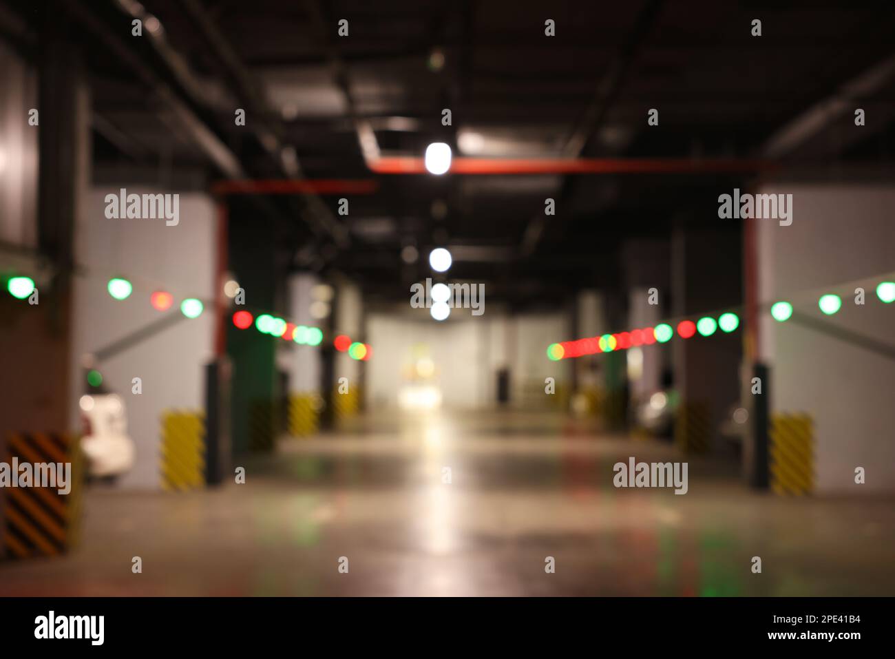 Blurred view of modern car parking garage Stock Photo - Alamy