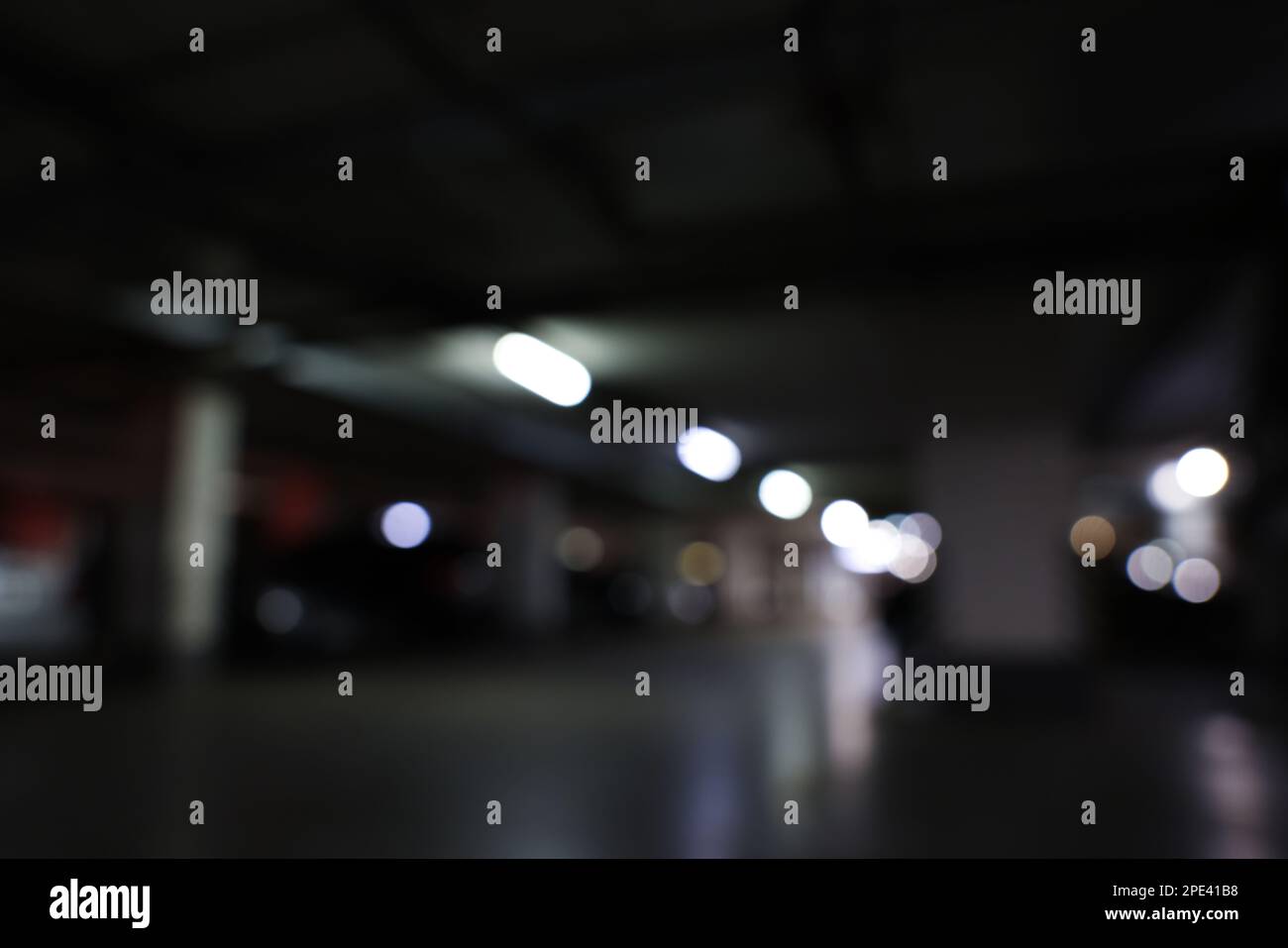 Blurred view of car parking garage at night Stock Photo - Alamy