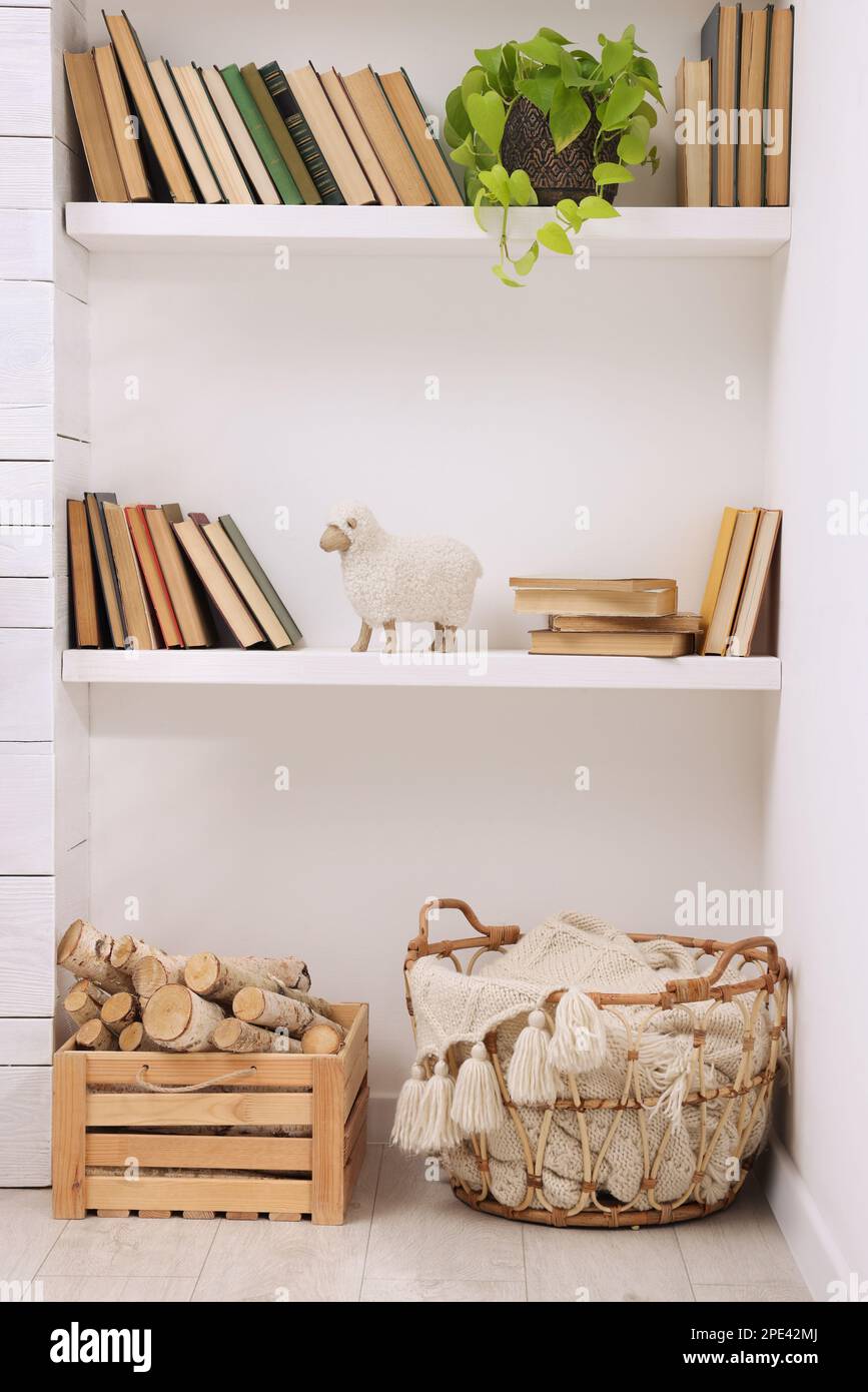 Collection of books and decor elements on shelves indoors. Interior ...