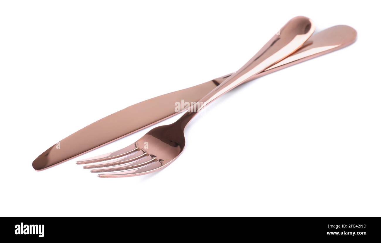 New shiny fork and knife on white background Stock Photo - Alamy
