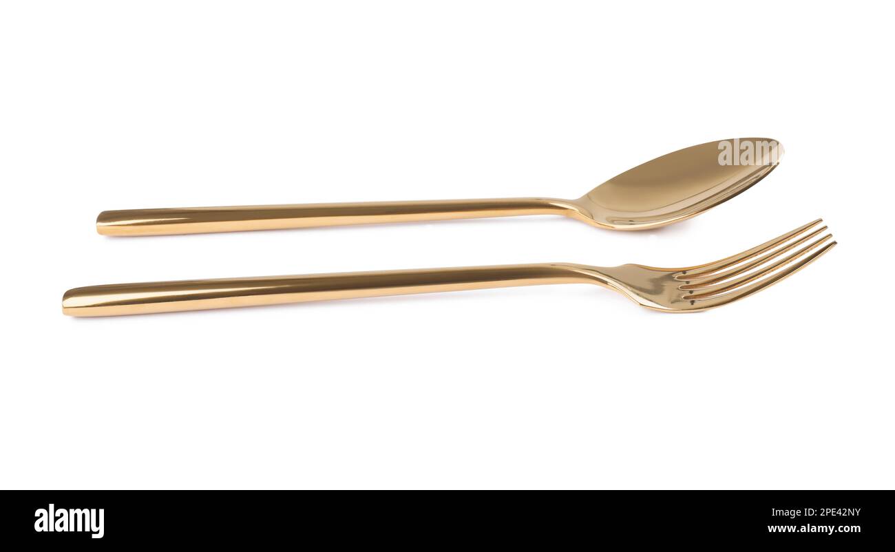 New shiny golden fork and spoon on white background Stock Photo - Alamy