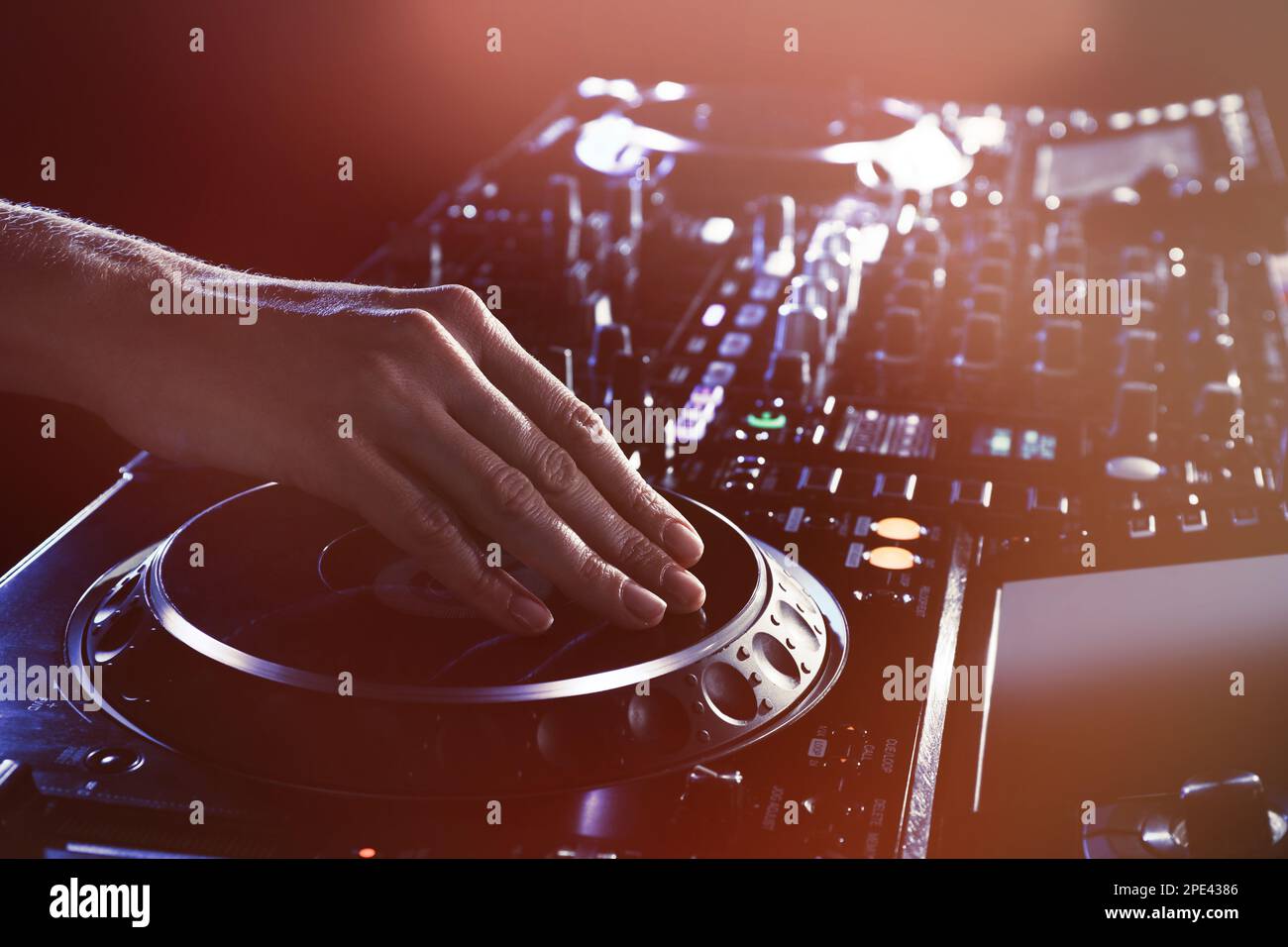 DJ creating music on modern console mixer in night club, closeup Stock ...