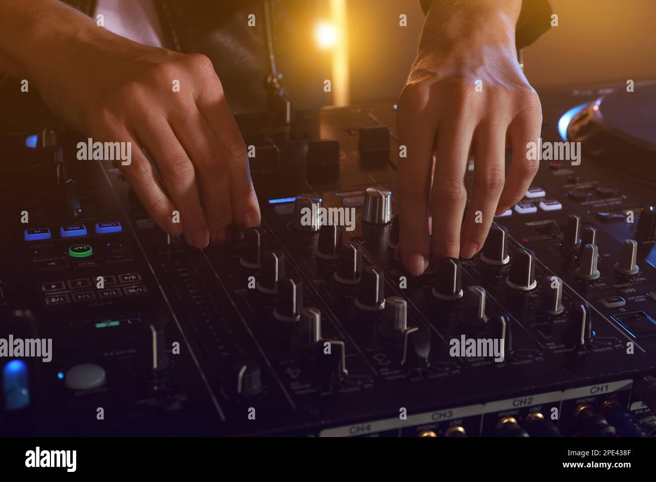 DJ creating music on modern console mixer in night club, closeup Stock ...