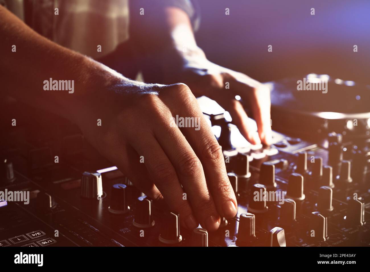 DJ creating music on modern console mixer in night club, closeup Stock ...