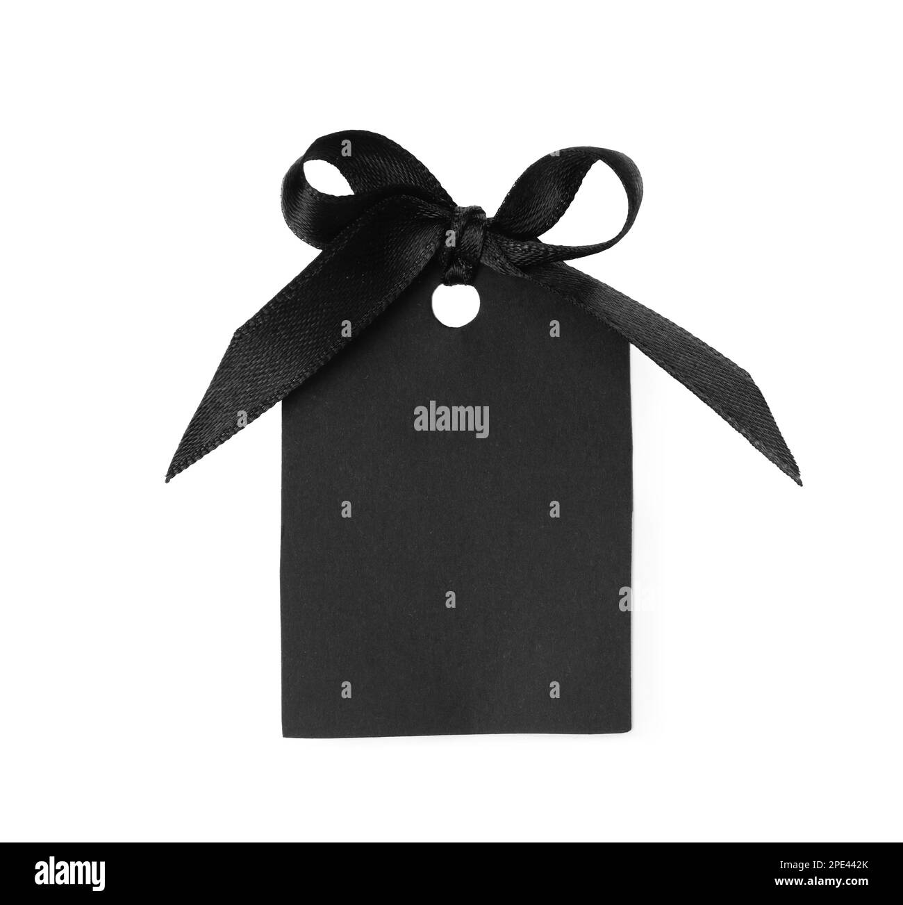 Blank tag with black satin ribbon tied in bow on white background, top ...