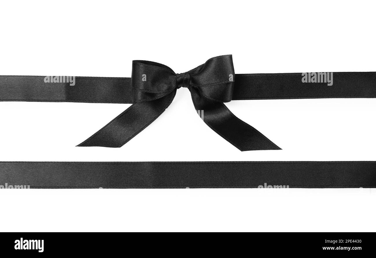 Black satin ribbons with bow on white background, top view Stock Photo ...