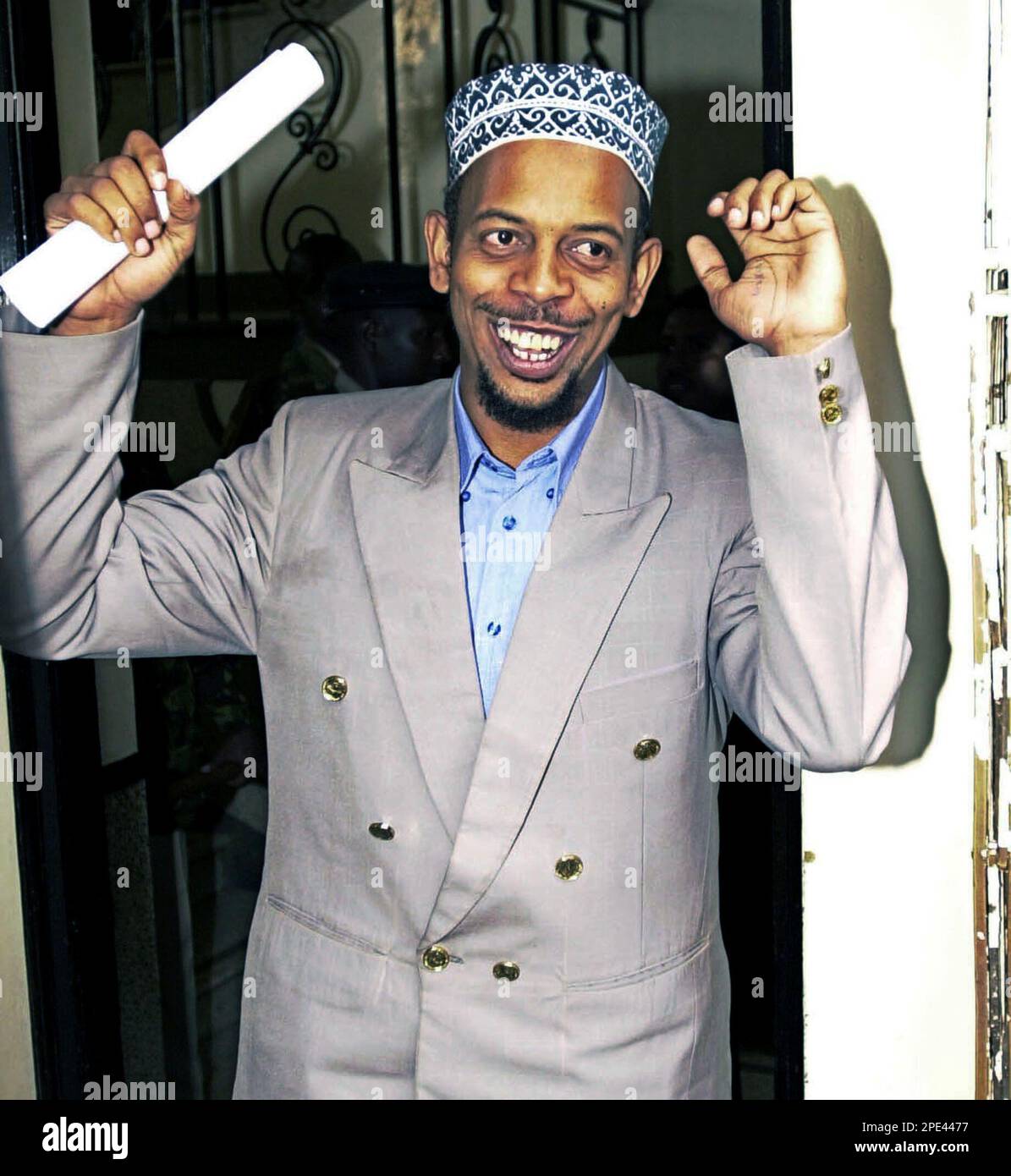 Omar Said Omar comes out of the Nairobi court to get into a prison van ...