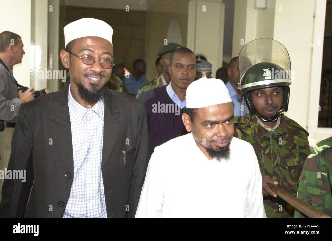 From left, Mohamed Kubwa, and Aboud Rogo Mohammed with prisons security ...