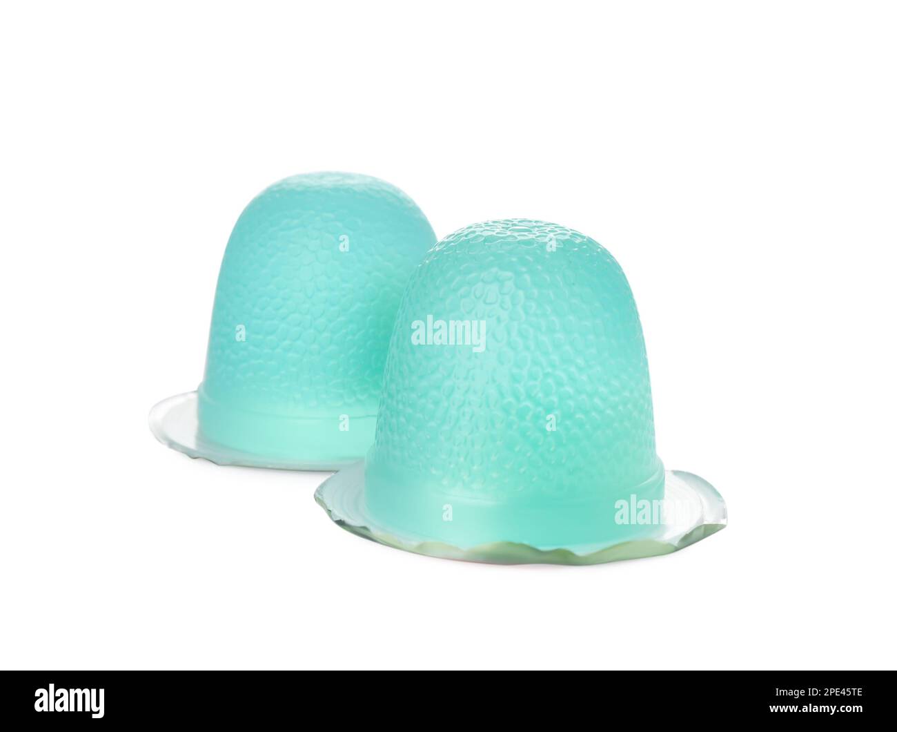 Delicious light blue jelly cups on white background Stock Photo - Alamy