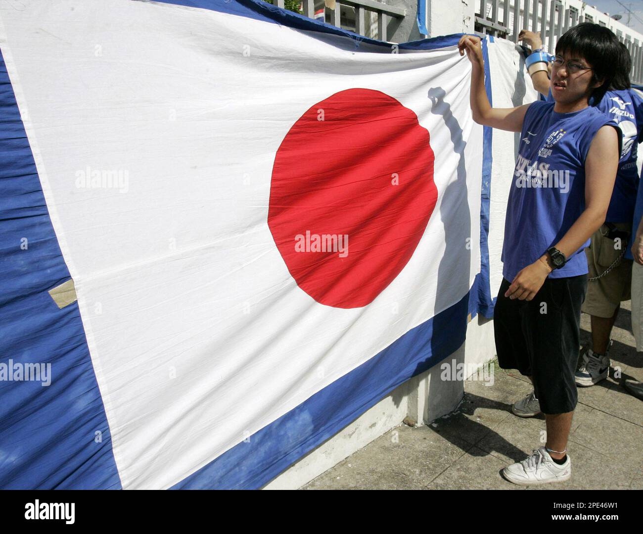 Japanese soccer fan puts their national flag outside National stadium ...