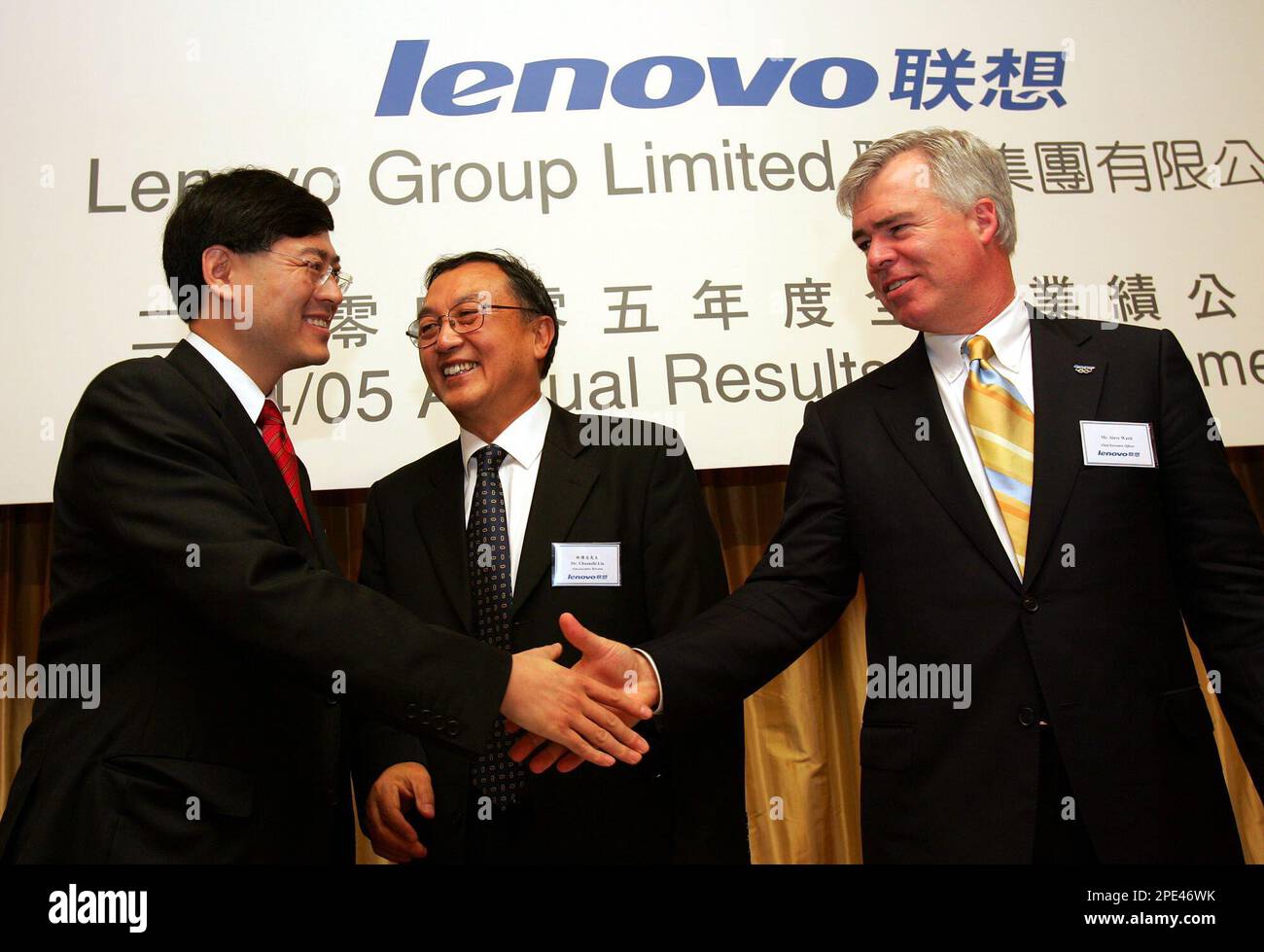 Chairman of China's Lenovo Group Ltd., Yang Yuanqing , left, shakes hands with Chief executive ...