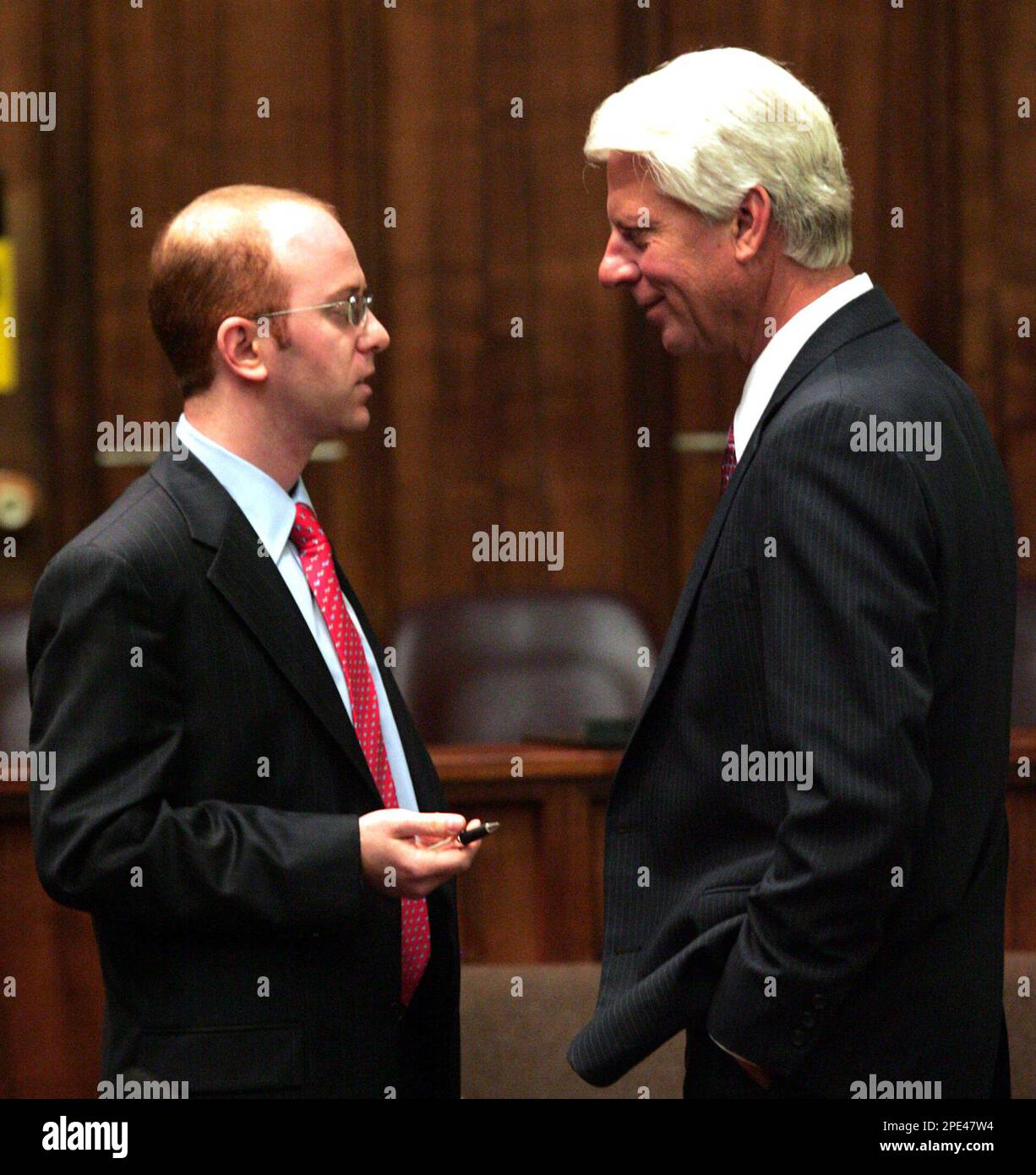Former America West pilot Thomas Cloyd, right, talks to his attorney ...