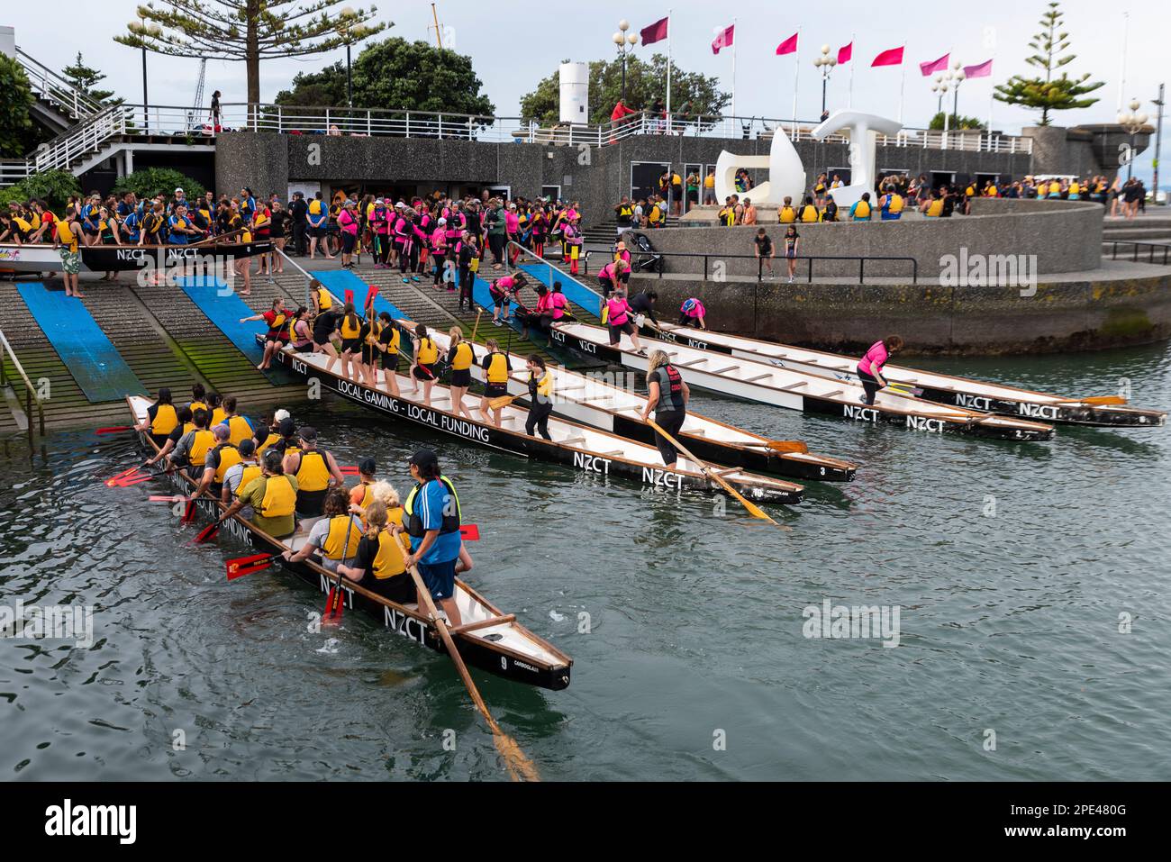 Dragon boat teams training in Whairepo Lagoon for a forthcoming ...