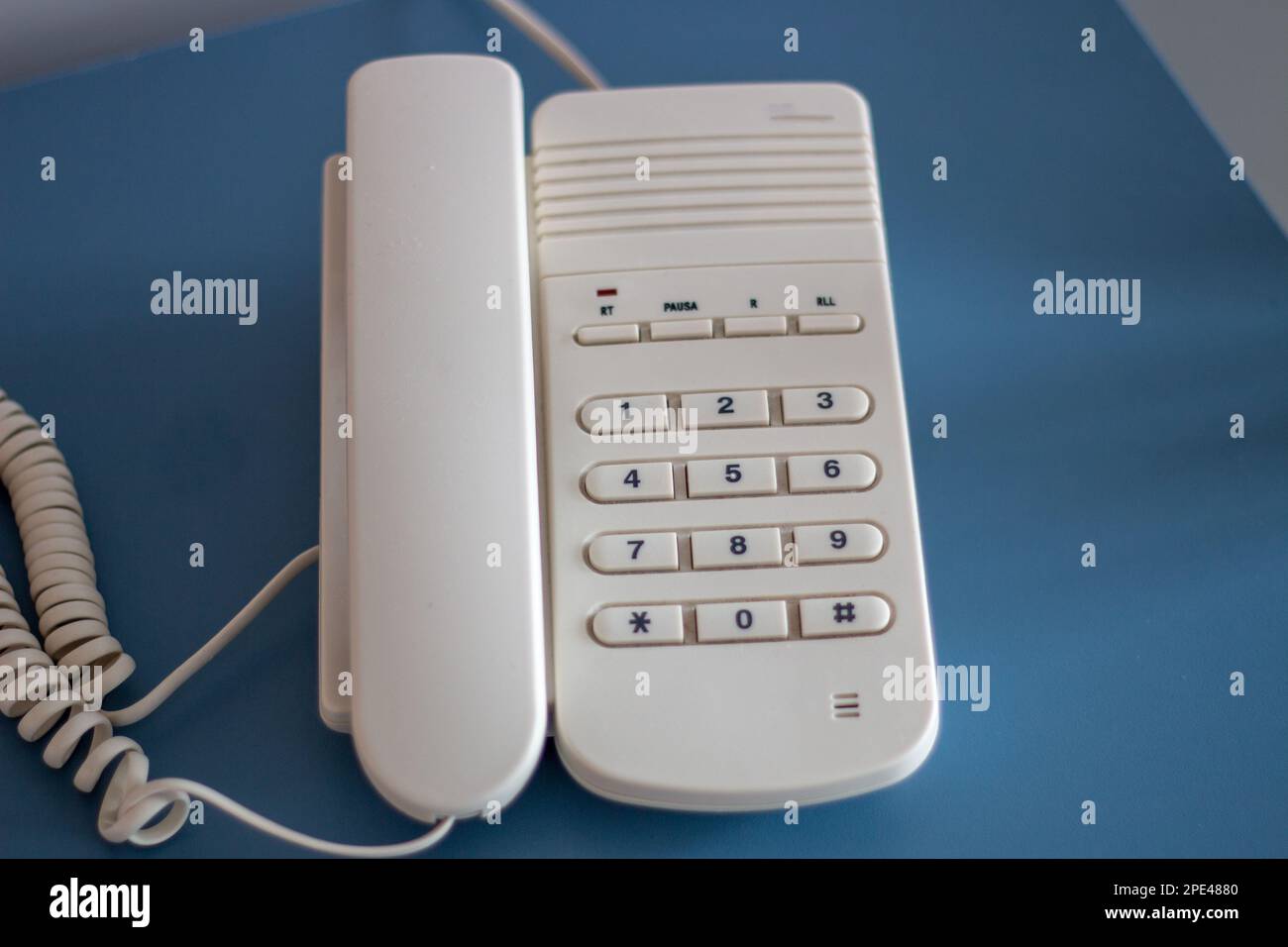 analogue desktop telephone with keys and cable Stock Photo - Alamy