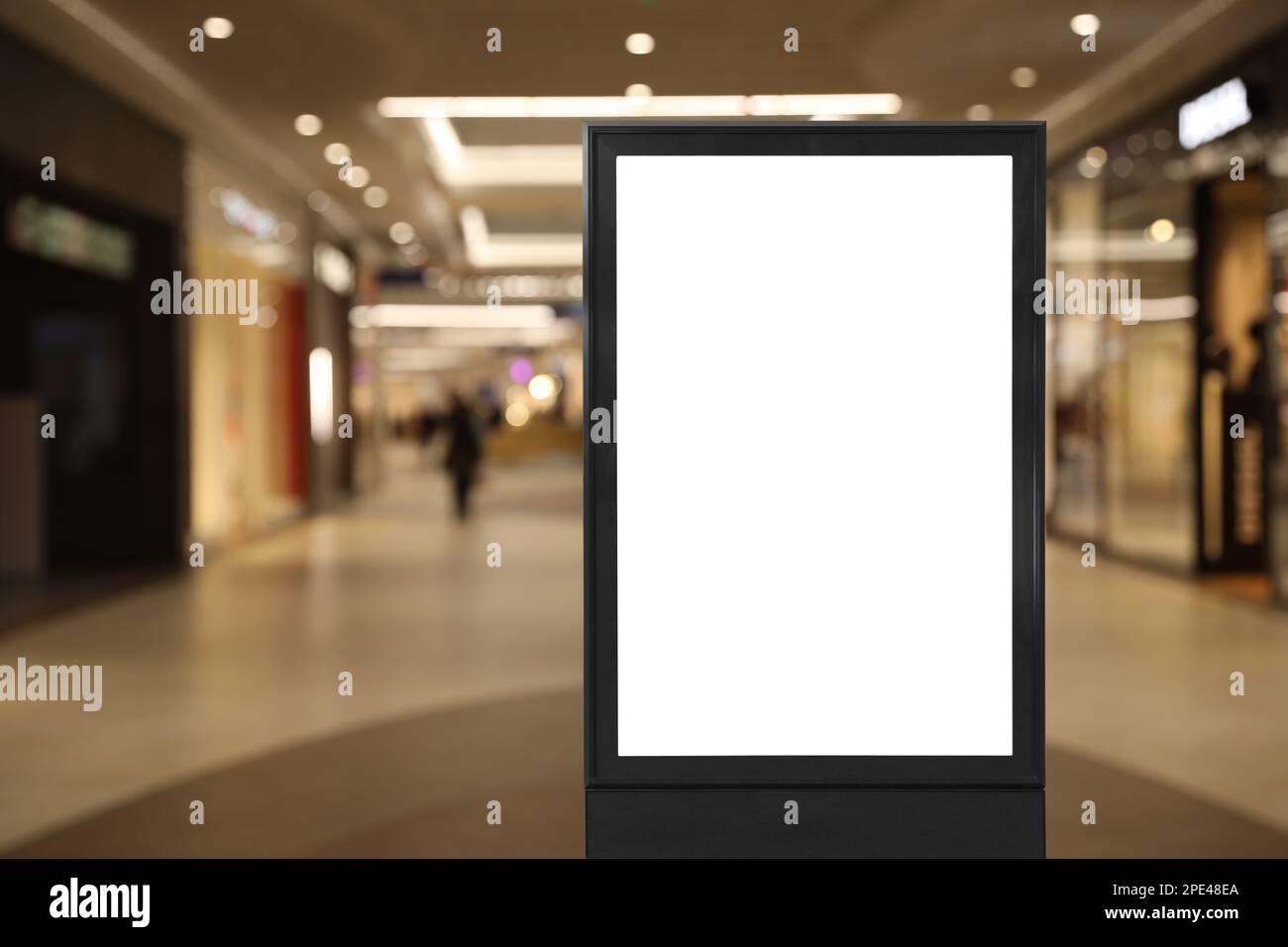 Blank advertising board in shopping mall. Space for text Stock Photo ...