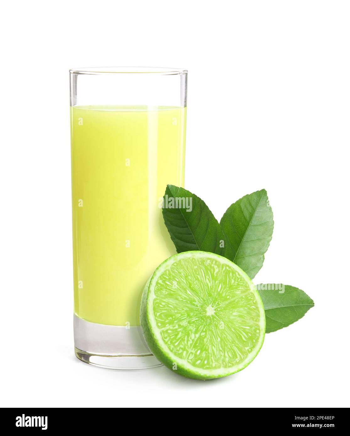 Glass of lime juice, fresh fruit and green leaves on white background ...