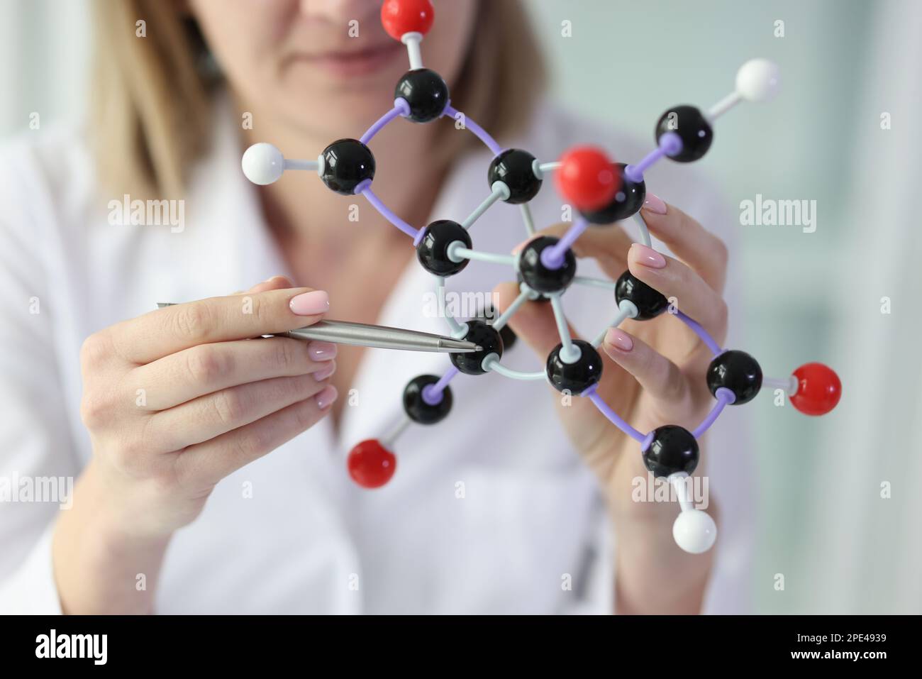 Female scientist studying molecular model hi-res stock photography and ...