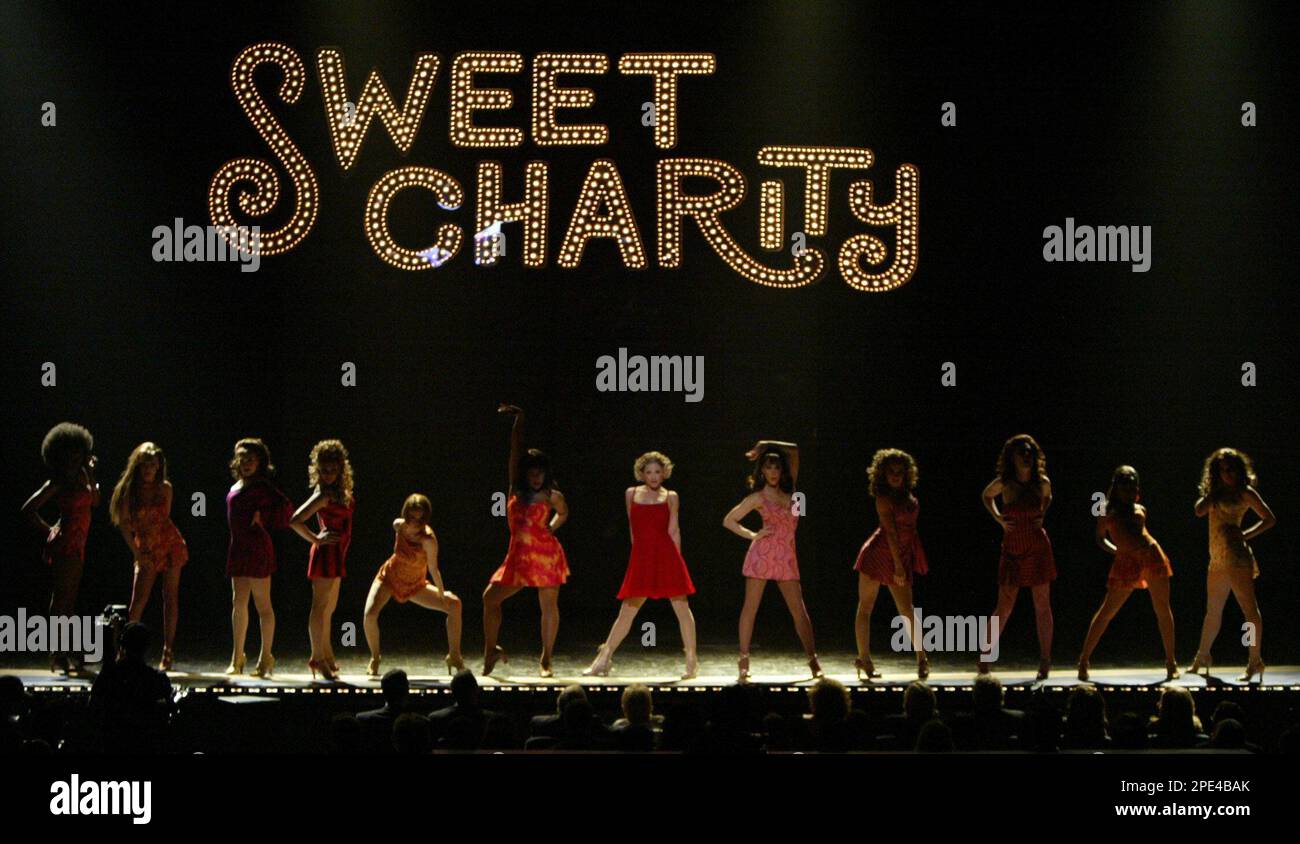 The cast of the Broadway musical "Sweet Charity" performs a number from ...