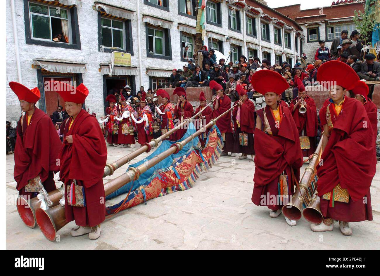 Lamas bugle during the Jumping Deities ceremony in the Zhikongti Temple ...