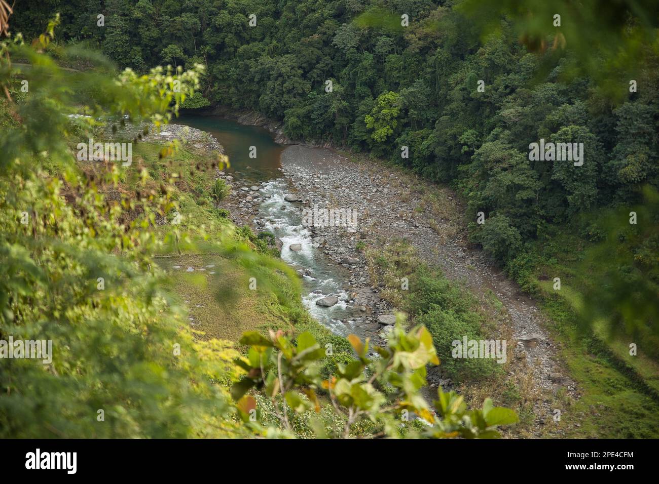 View of a valley in Banaue in the Philippines where a river is ...