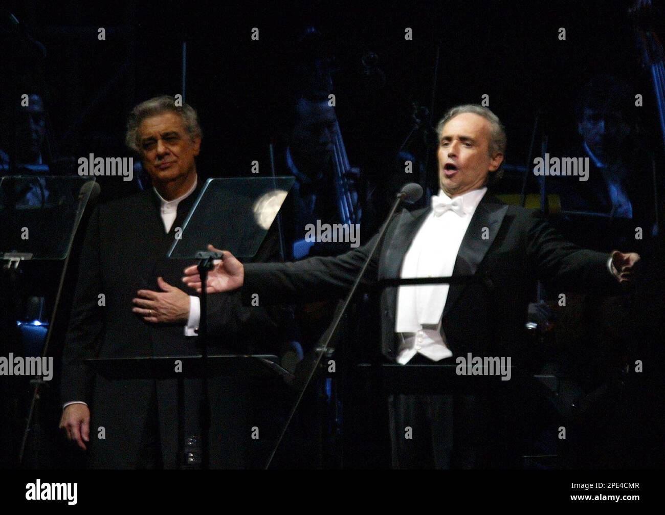 Jose Carreras, right, performs during a concert as Placido Domingo looks on at Fundidora park ...