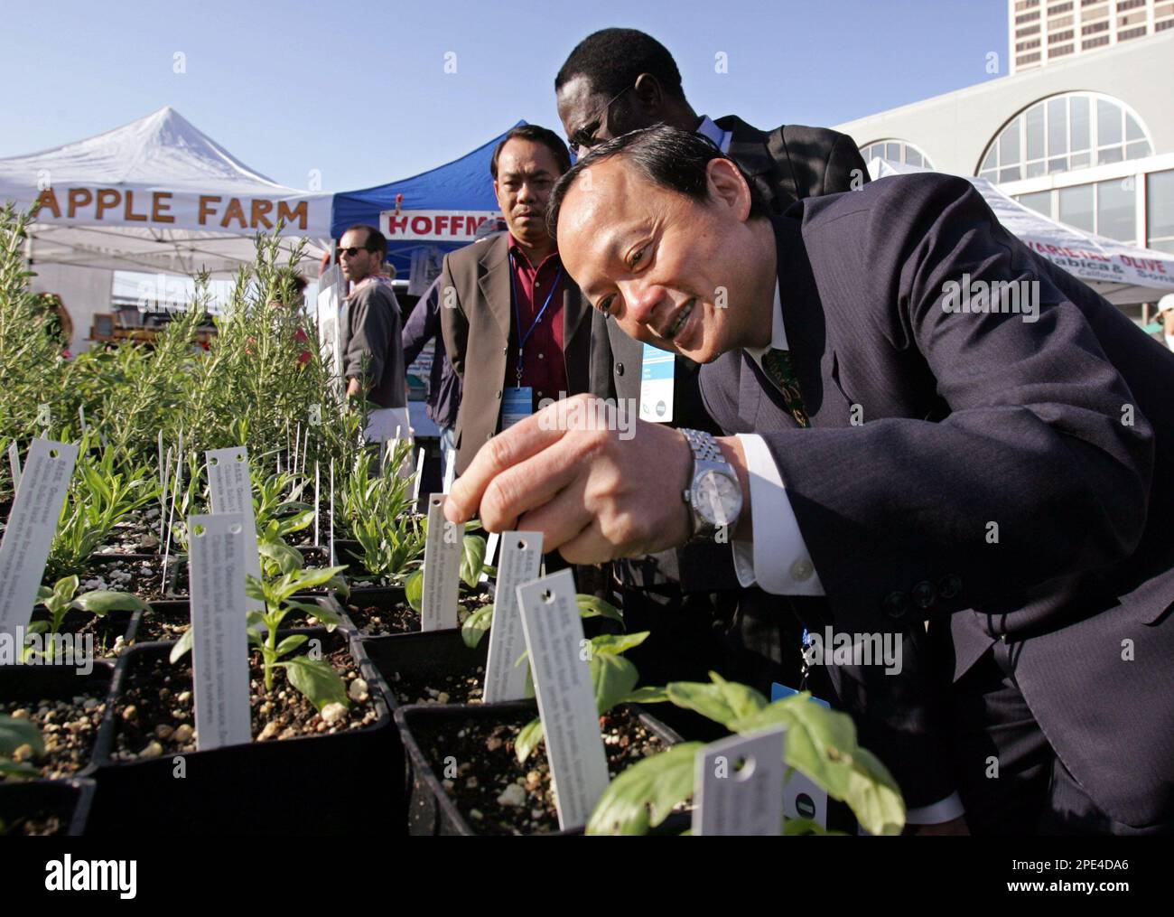 Taipei Deputy Mayor Ching-Chuan Yeh looks at plants while visiting the ...