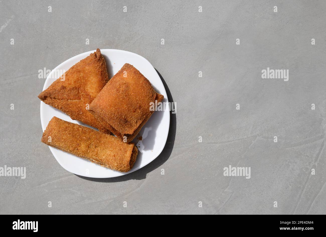 Sri Lankan Chinese Rolls different shape, short eats on gray background ...
