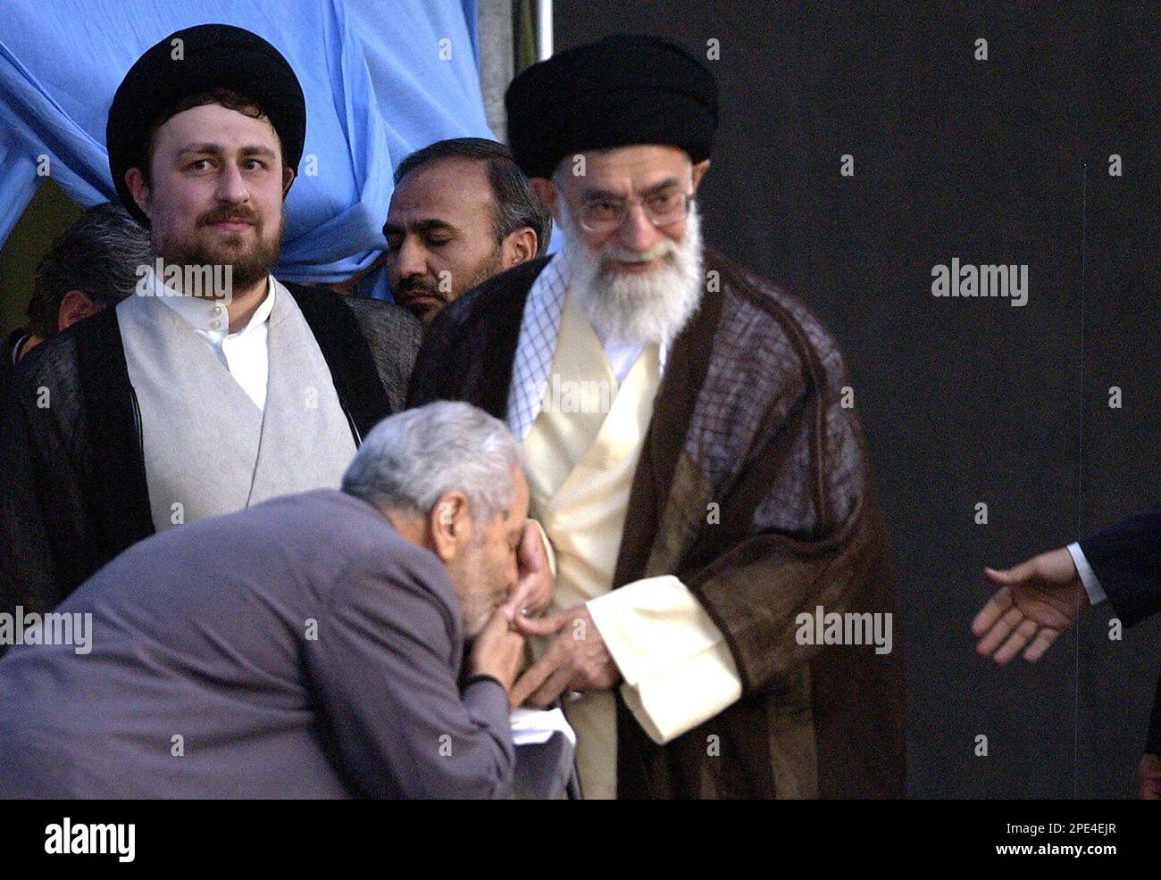 Iranian Morteza Mortezaeifar, kisses the hand of Iran's supreme leader ...