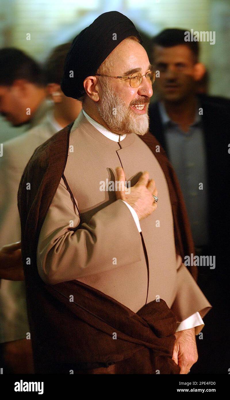 Iranian President Mohammad Khatami arrives to deliver his speech in a ...