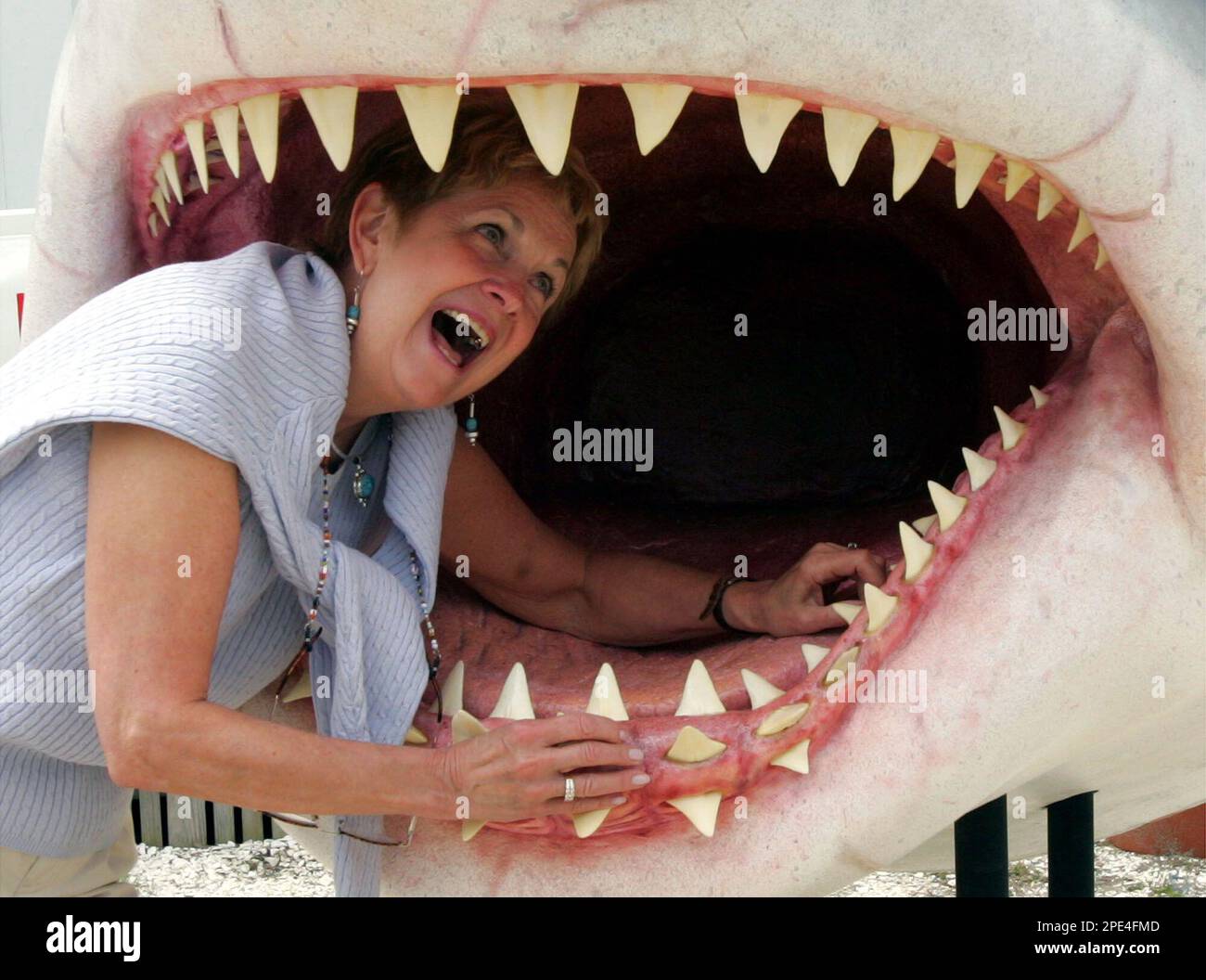 Diane Rock of Baldwinsville, N.Y., poses for photos with a replica of ...