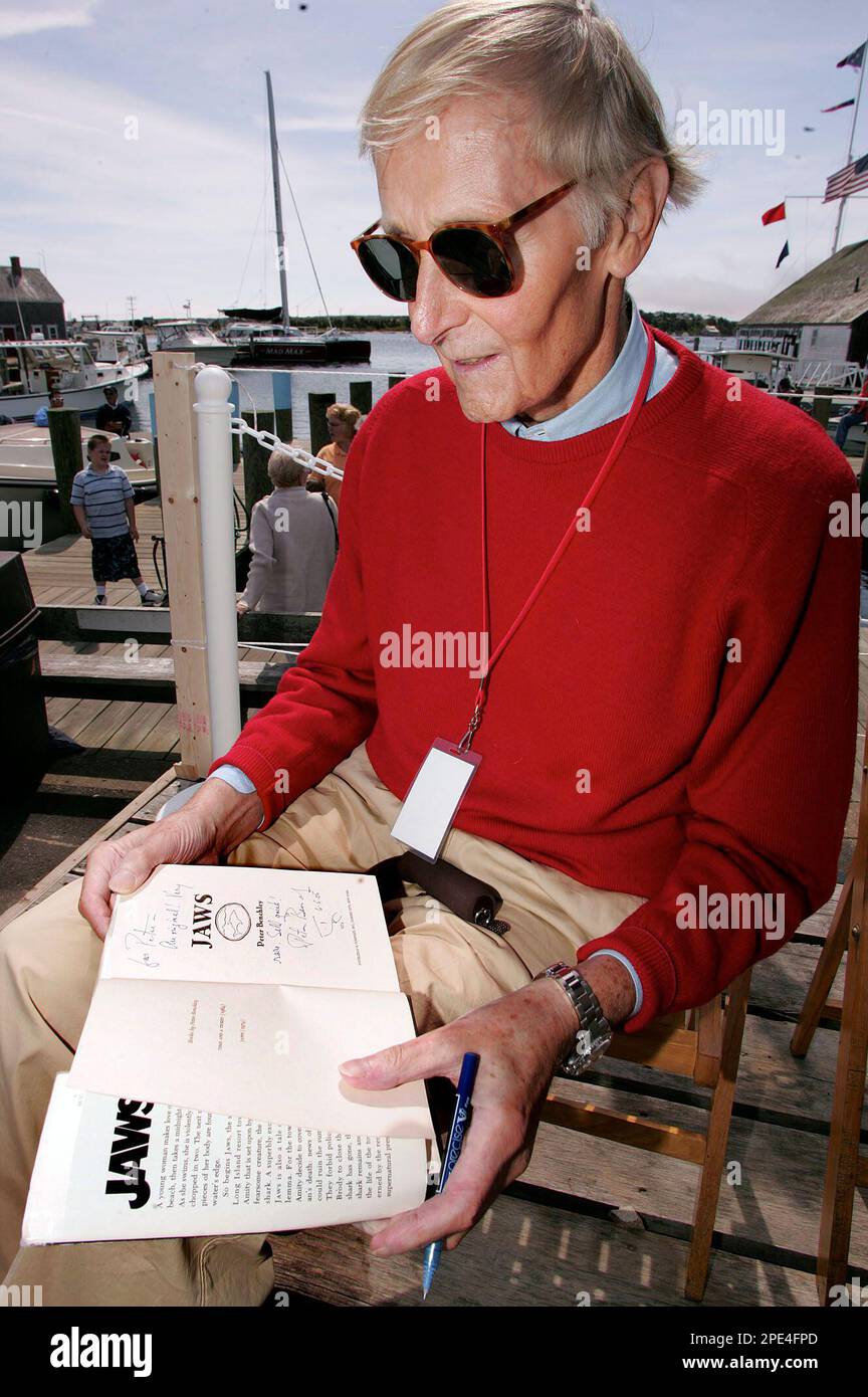 Peter Benchley, author of Jaws, signs an original copy of Jaws at a ...