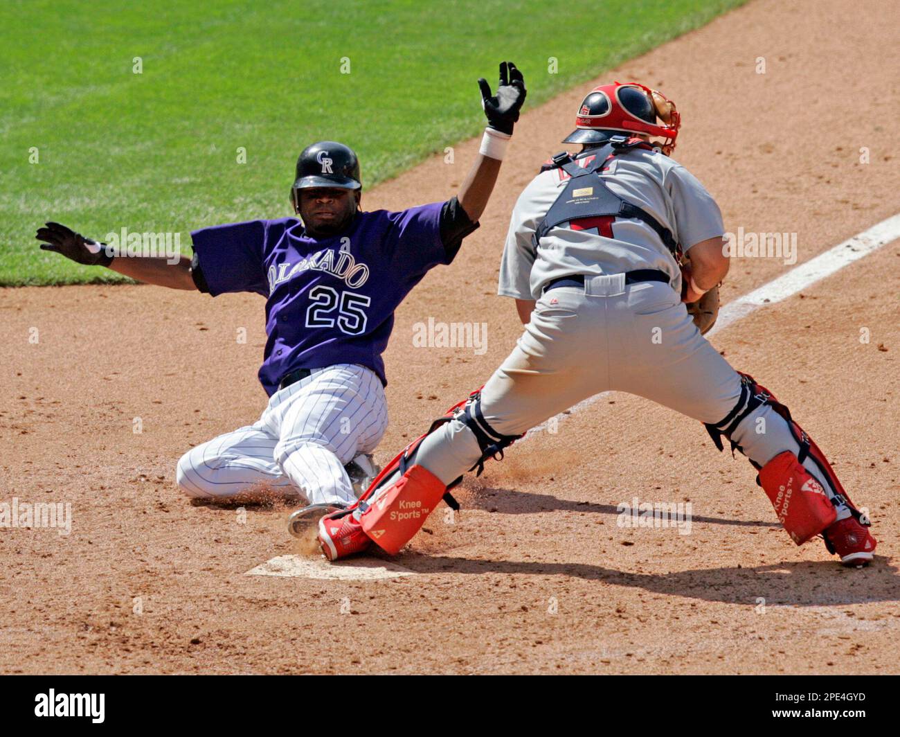 Colorado Rockies' Eddy Garabito slides safe into home as St. Louis ...