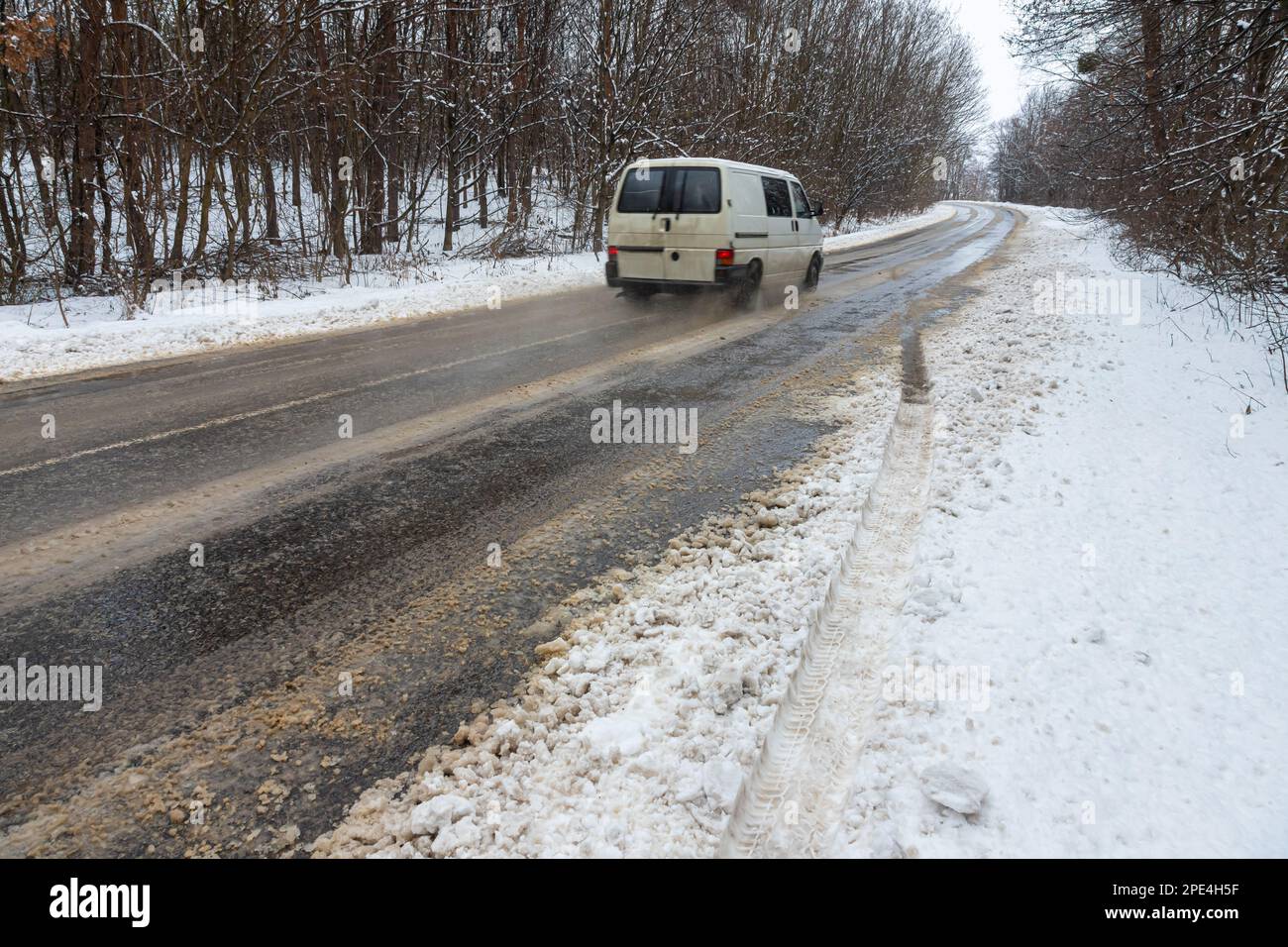 driving in winter after a snowfall, ice on the road, temperatures below ...