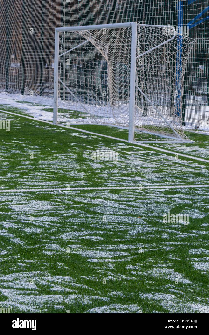 field for playing football in winter, artificial grass on cleared of ...