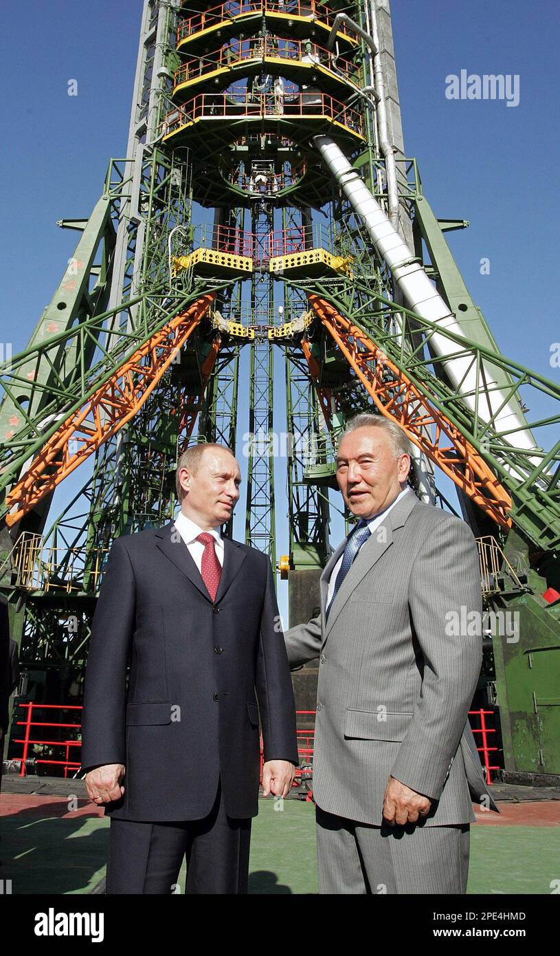 Russian President Vladimir Putin, left, and Kazakhstan's President Nursultan Nazarbayev, right ...