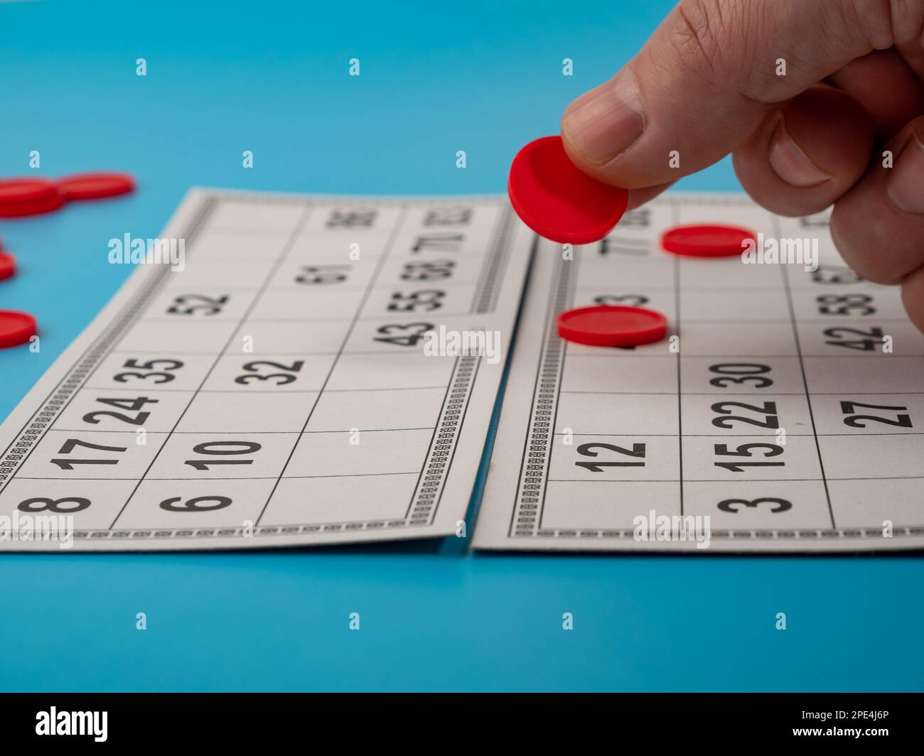 Board game bingo. Plastic playing chips in hand. Close-up Stock Photo ...