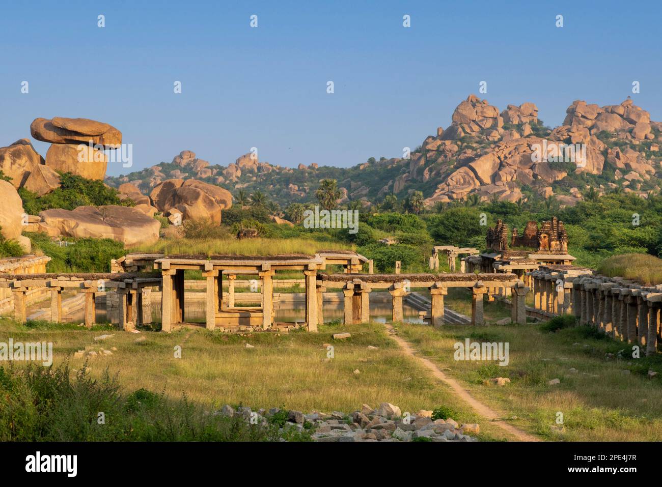 Ruins of old bazaar and Pushkarni lake in front of Krishna Temple in ...