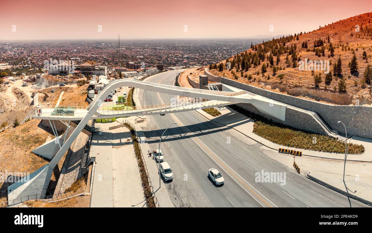 Aerial view of a pedestrian bridge for safe crossing of a fast and busy ...